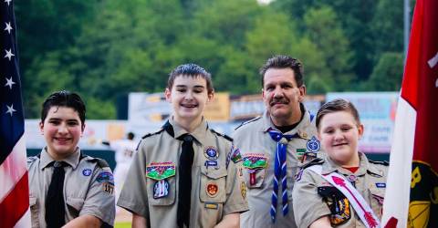 Scouts carry the colors