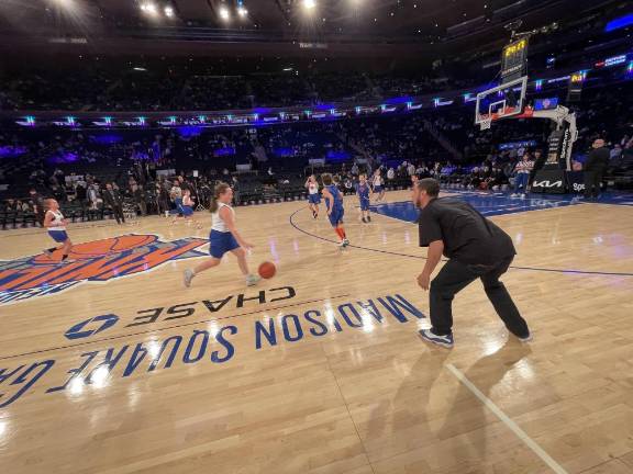 Davey coaches young players at the Garden