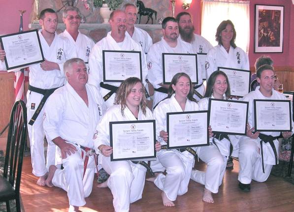 Karate academy promotes 11